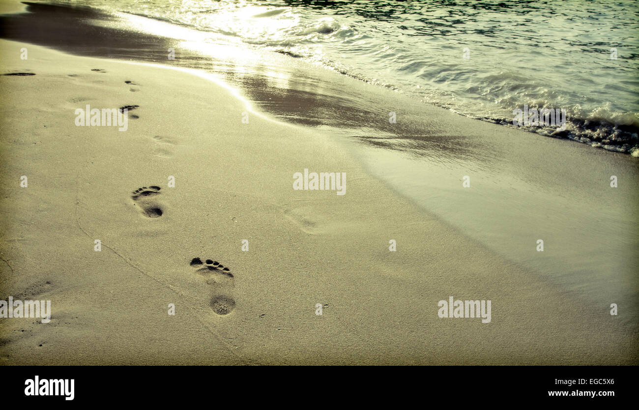 Footsteps in the sand at the beach Stock Photo - Alamy