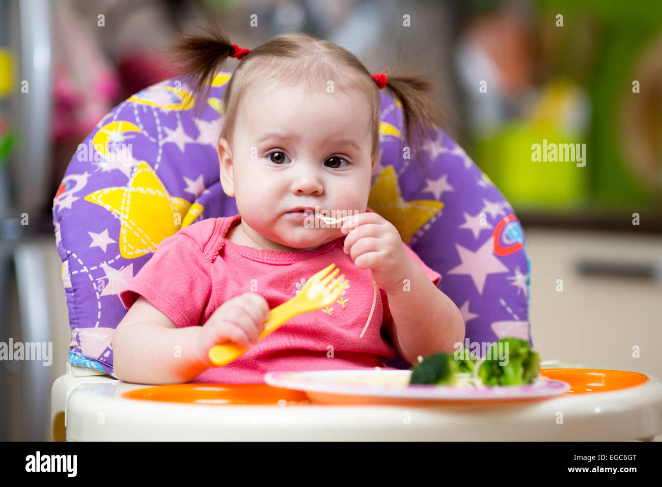 kid eating food on kitchen Stock Photo - Alamy