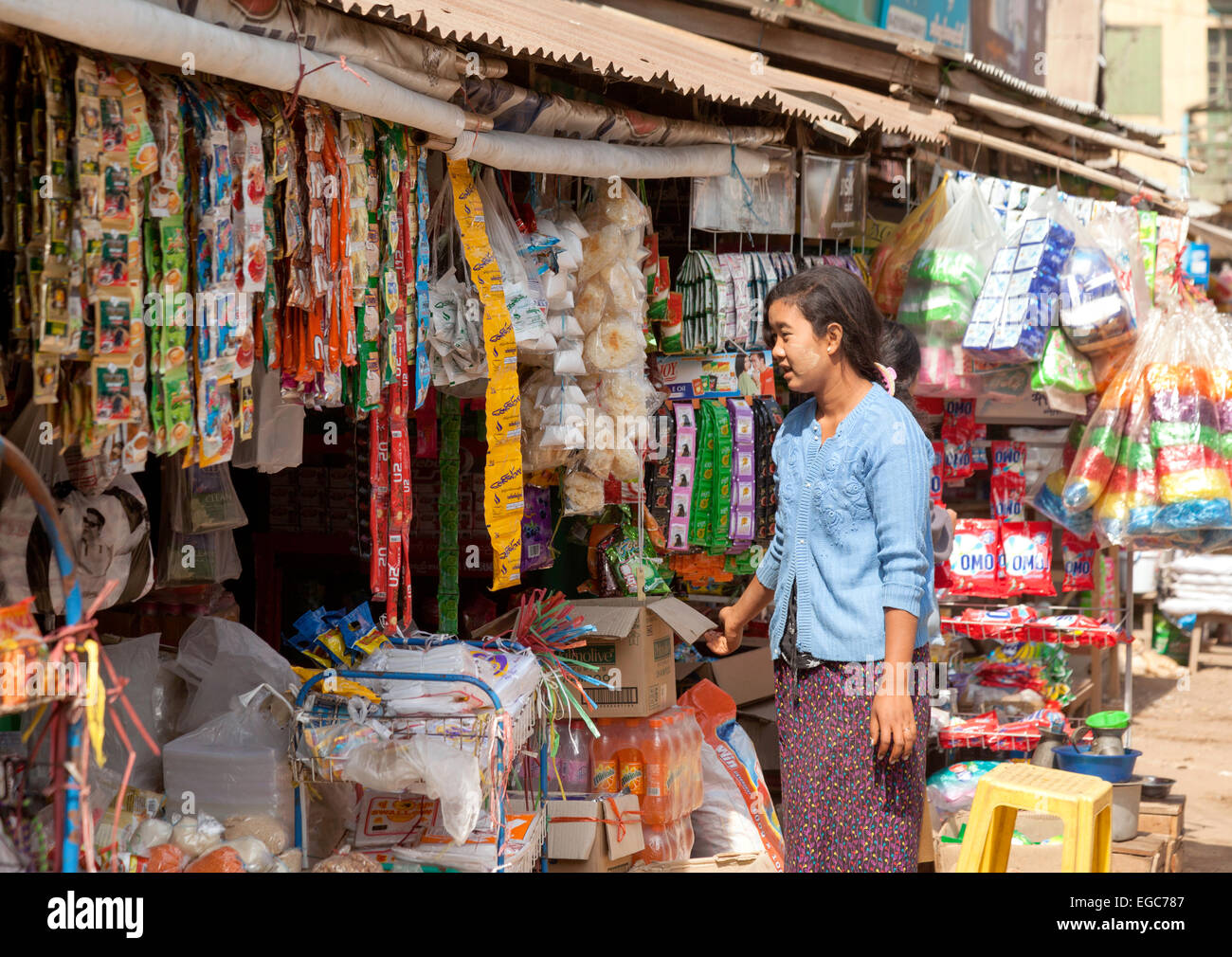 A young Burmese woman shopping at the local village market, Mani Sithu ...