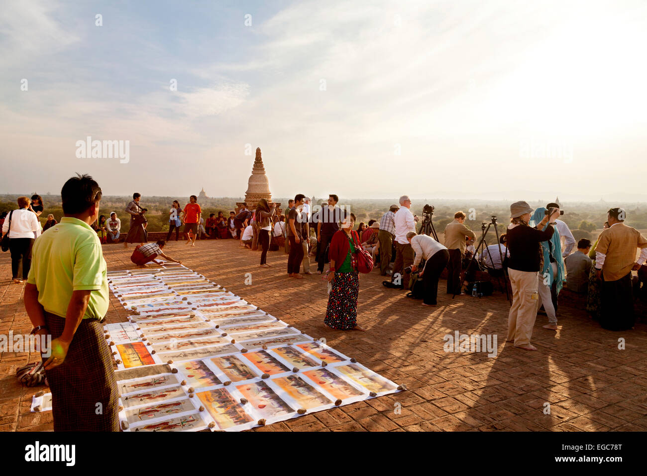 Tourists and tourist stalls on Pya-Tha-Da Pagoda at sunset, Bagan ...