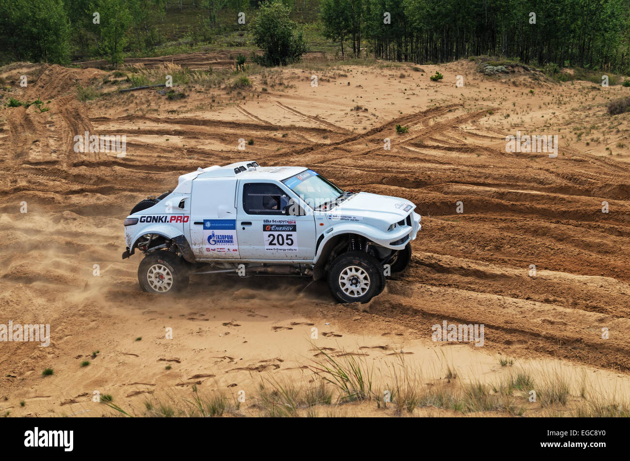 Races on a rally-raid on sandy dunes. Rally-raid Baha "Belarus" 2014 ...