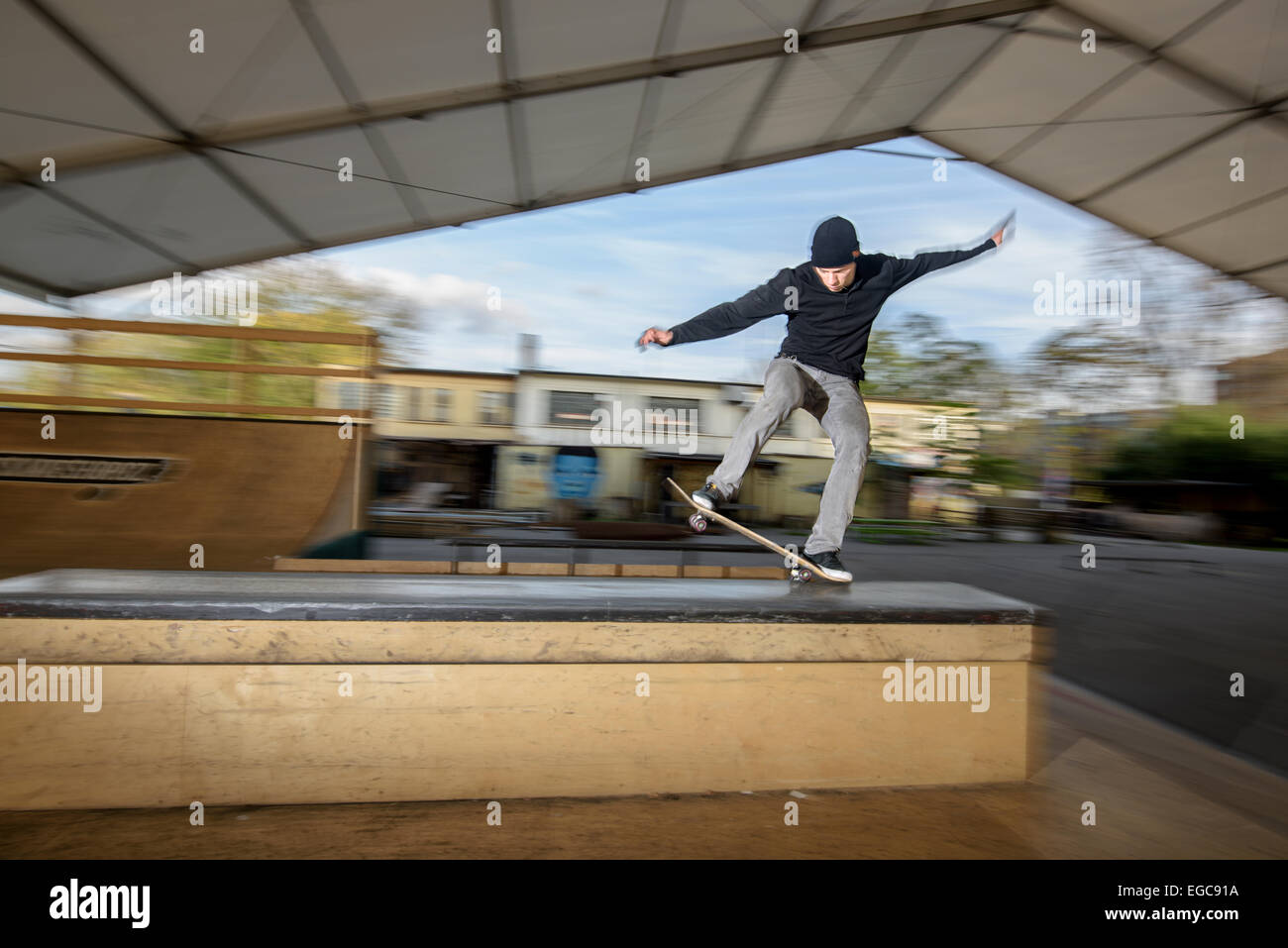 Skater in skatepark jumping Stock Photo - Alamy