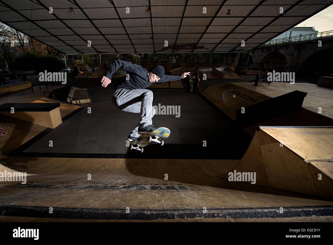 Skater in skatepark jumping Stock Photo - Alamy
