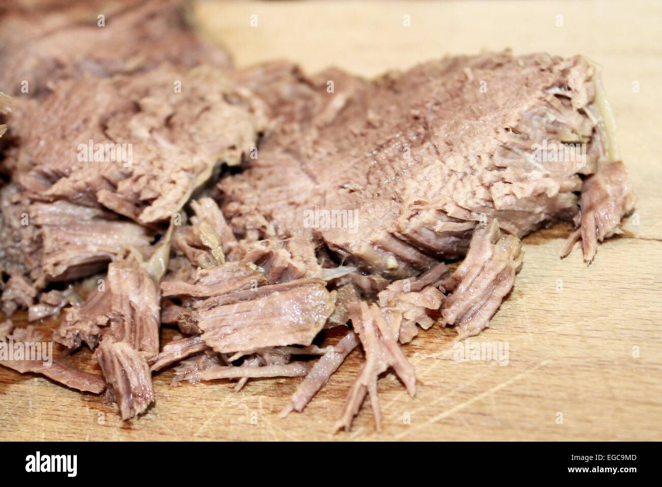 boiled beef on wooden cutting board Stock Photo - Alamy
