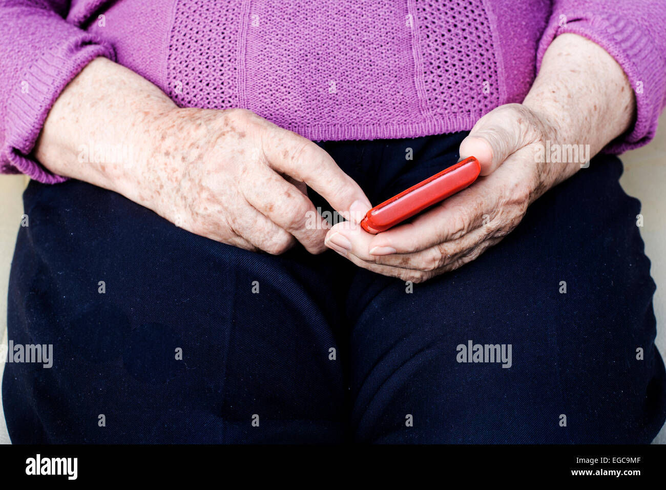 Elder woman calling someone or texting messages on the smartphone Stock ...