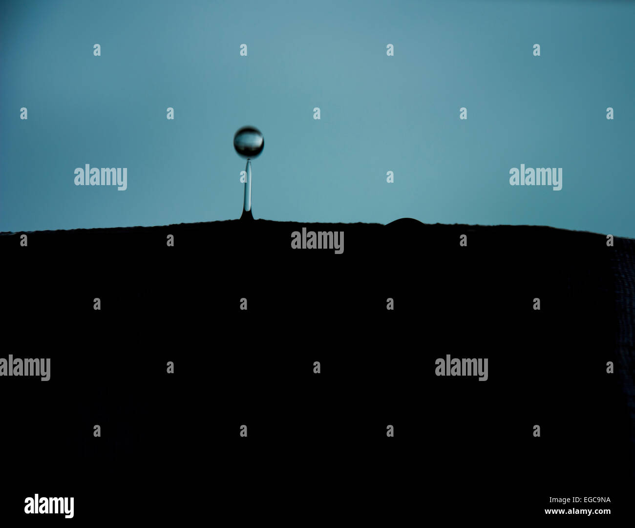 Rain drop hanging from parasol up side down Stock Photo - Alamy