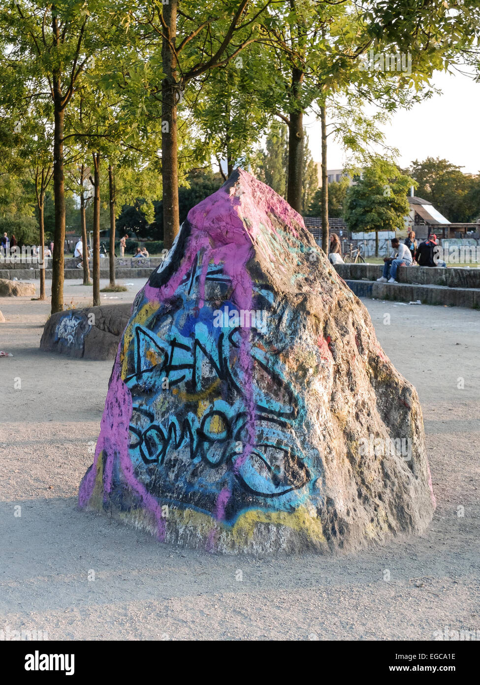 Graffiti-painted rock in Mauerpark, Berlin on a summer evening Stock ...