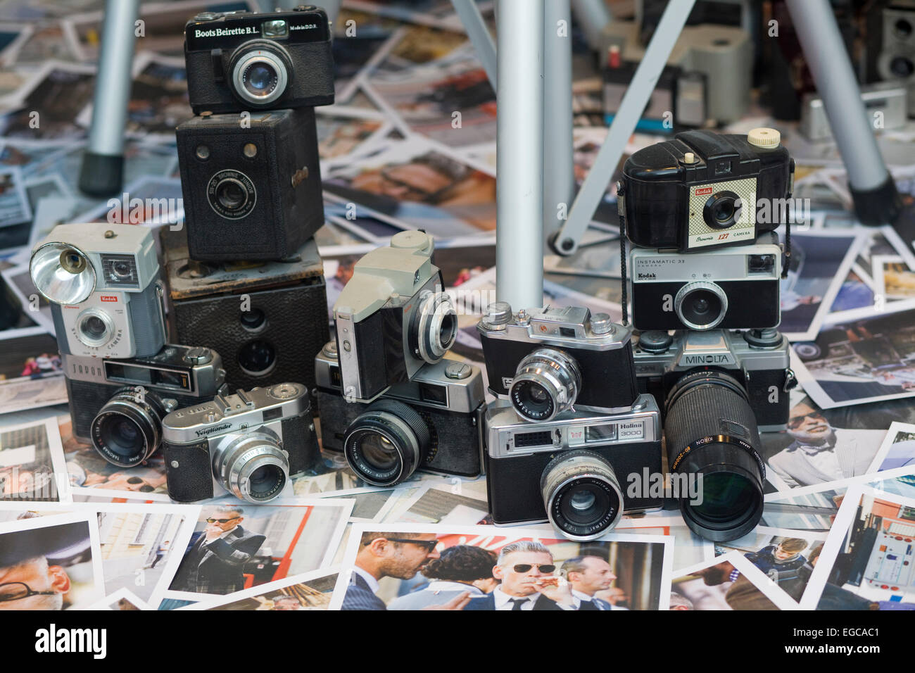 Collection of vintage cameras on photographs Stock Photo - Alamy