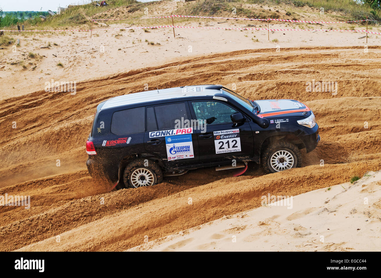 Races on a rally-raid on sandy dunes. Rally-raid Baha "Belarus" 2014 ...