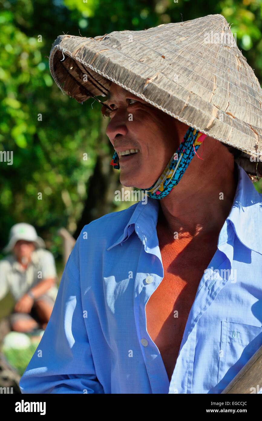 A river boatman on the Mekong river at Cần Thơ in the Mekong Delta.It ...