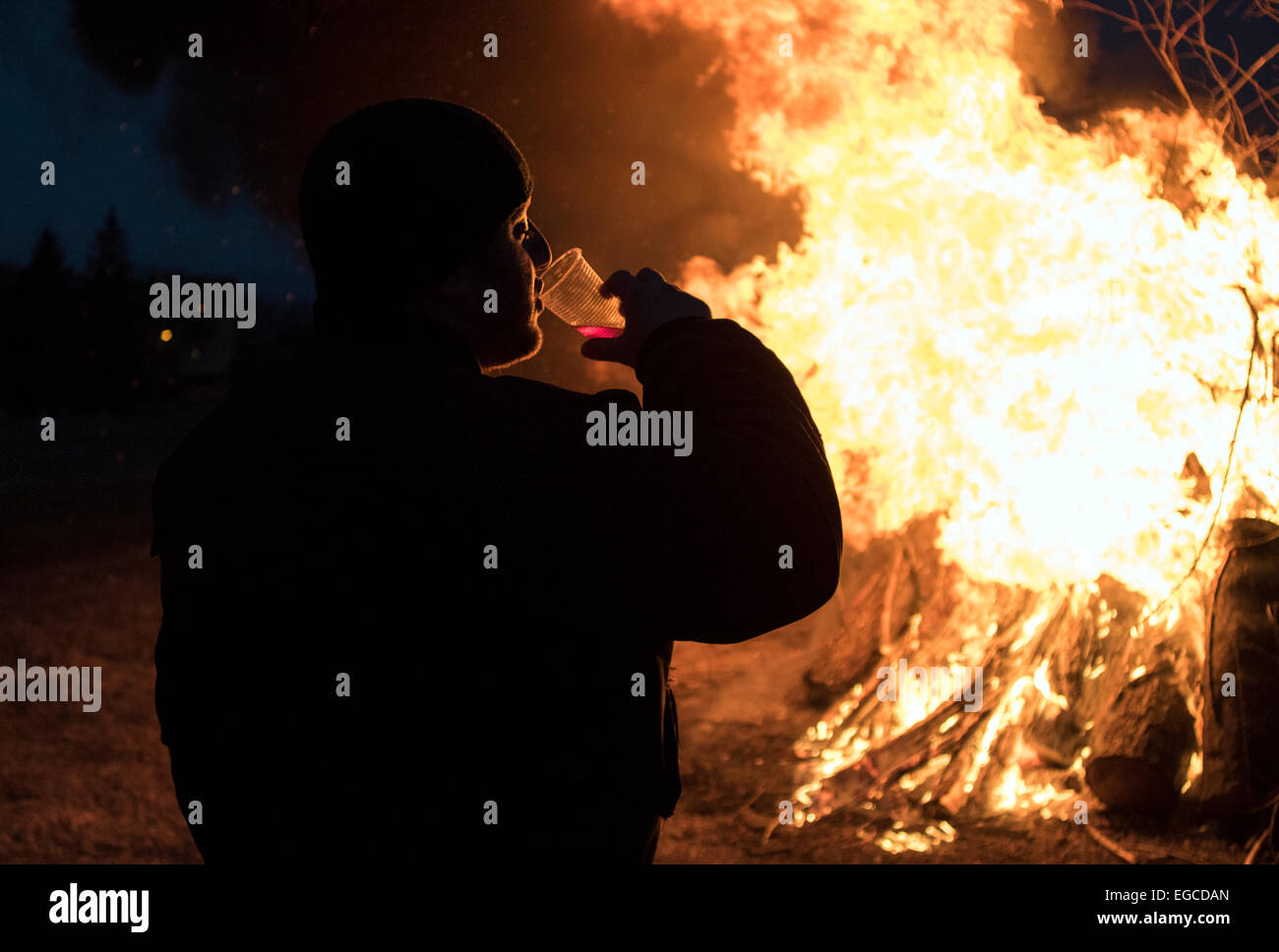 A man infront of the bonfire during the Forgiveness Sunday ...