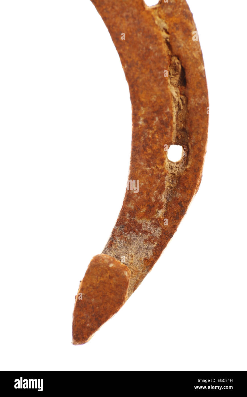 Color shot of a rusty horse shoe isolated on white Stock Photo - Alamy