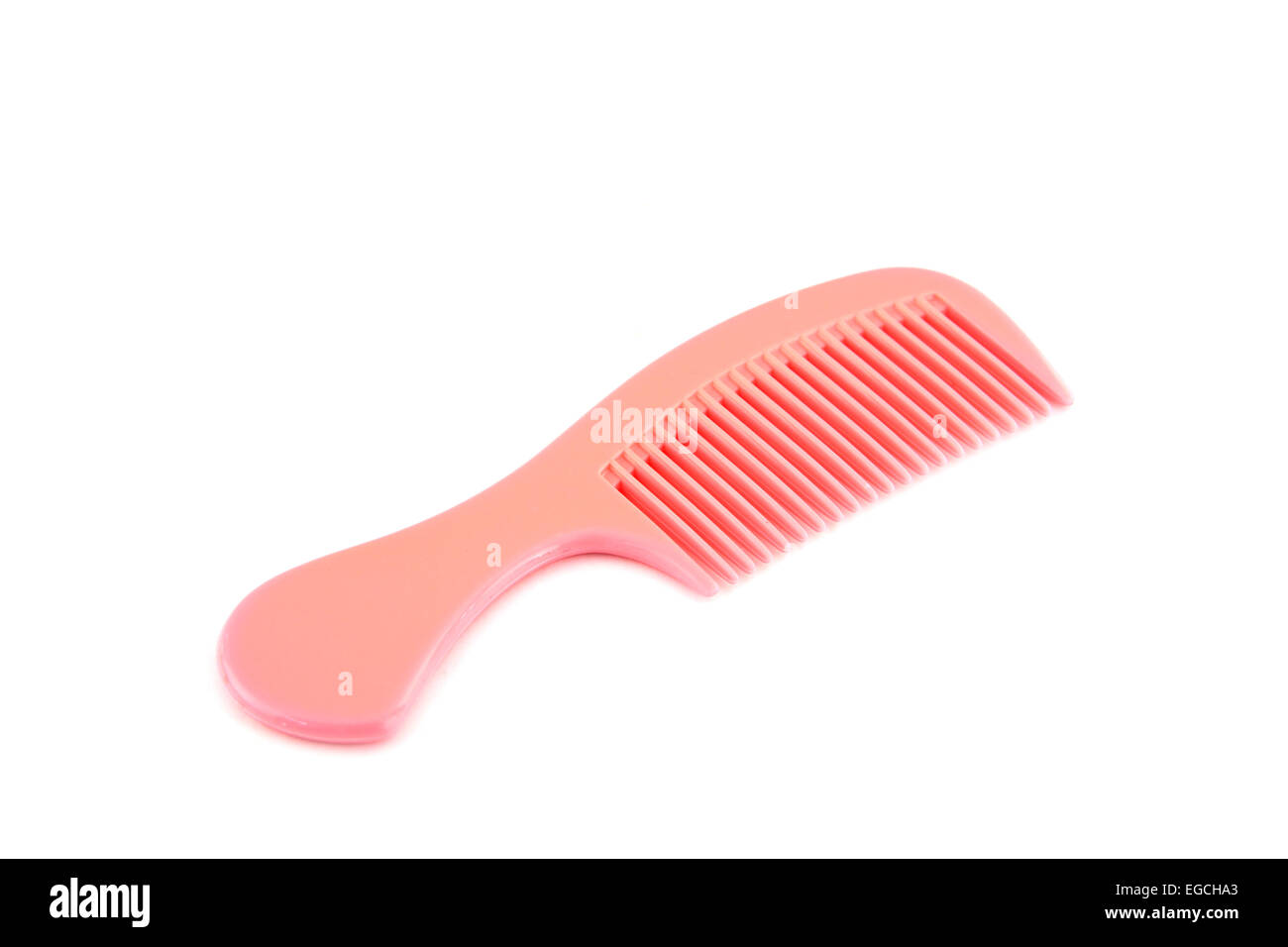 orange combed tool on white background Stock Photo - Alamy