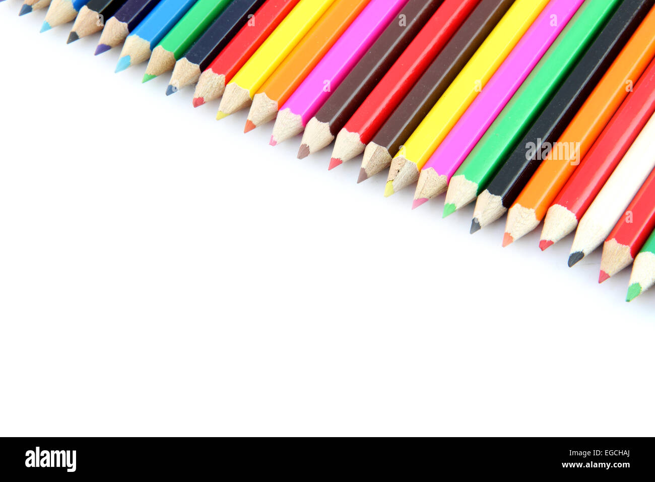 Mix colored crayons on a white background Stock Photo - Alamy