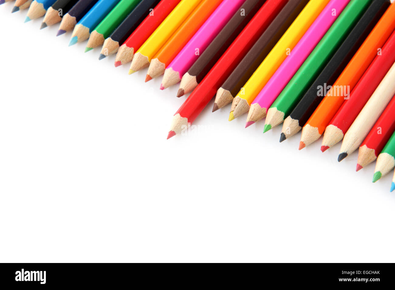 Mix colored crayons on a white background Stock Photo - Alamy