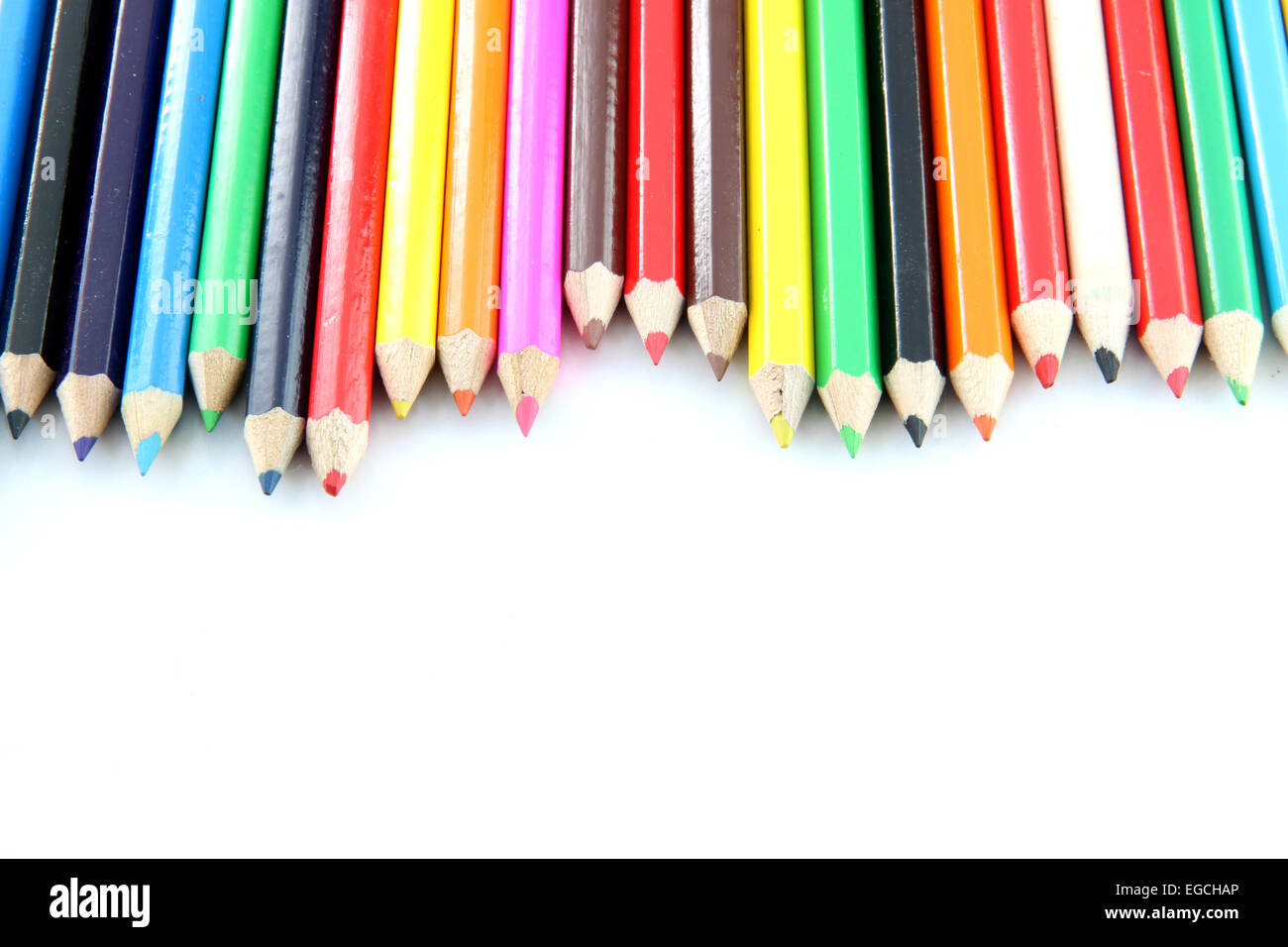 Mix colored crayons on a white background Stock Photo - Alamy