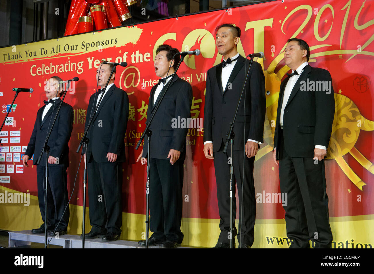 Male Chinese singers performing on stage at Chinese New Year ...