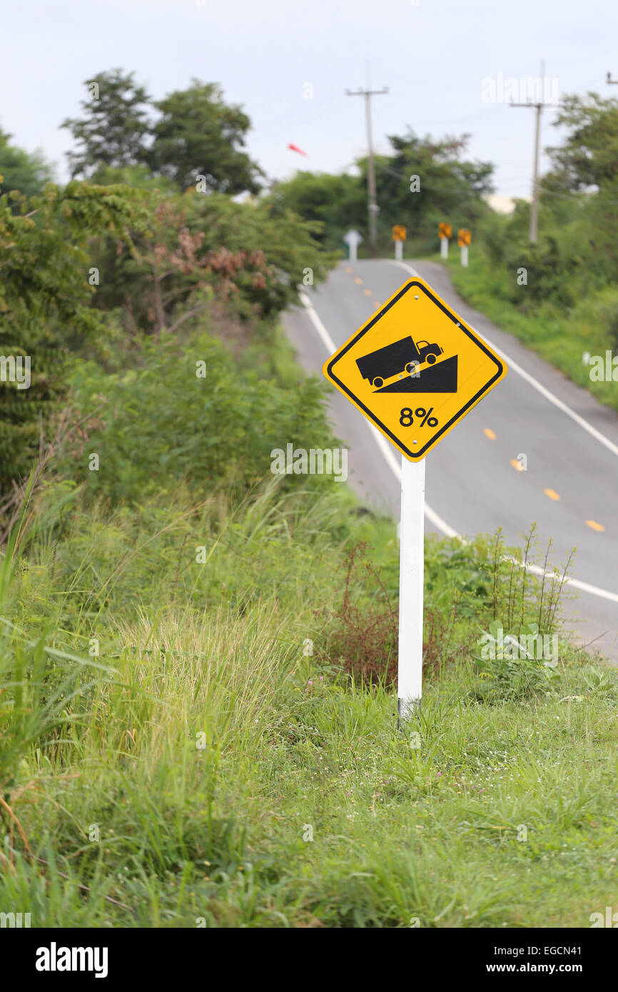 Signposted slope on roadway Stock Photo - Alamy