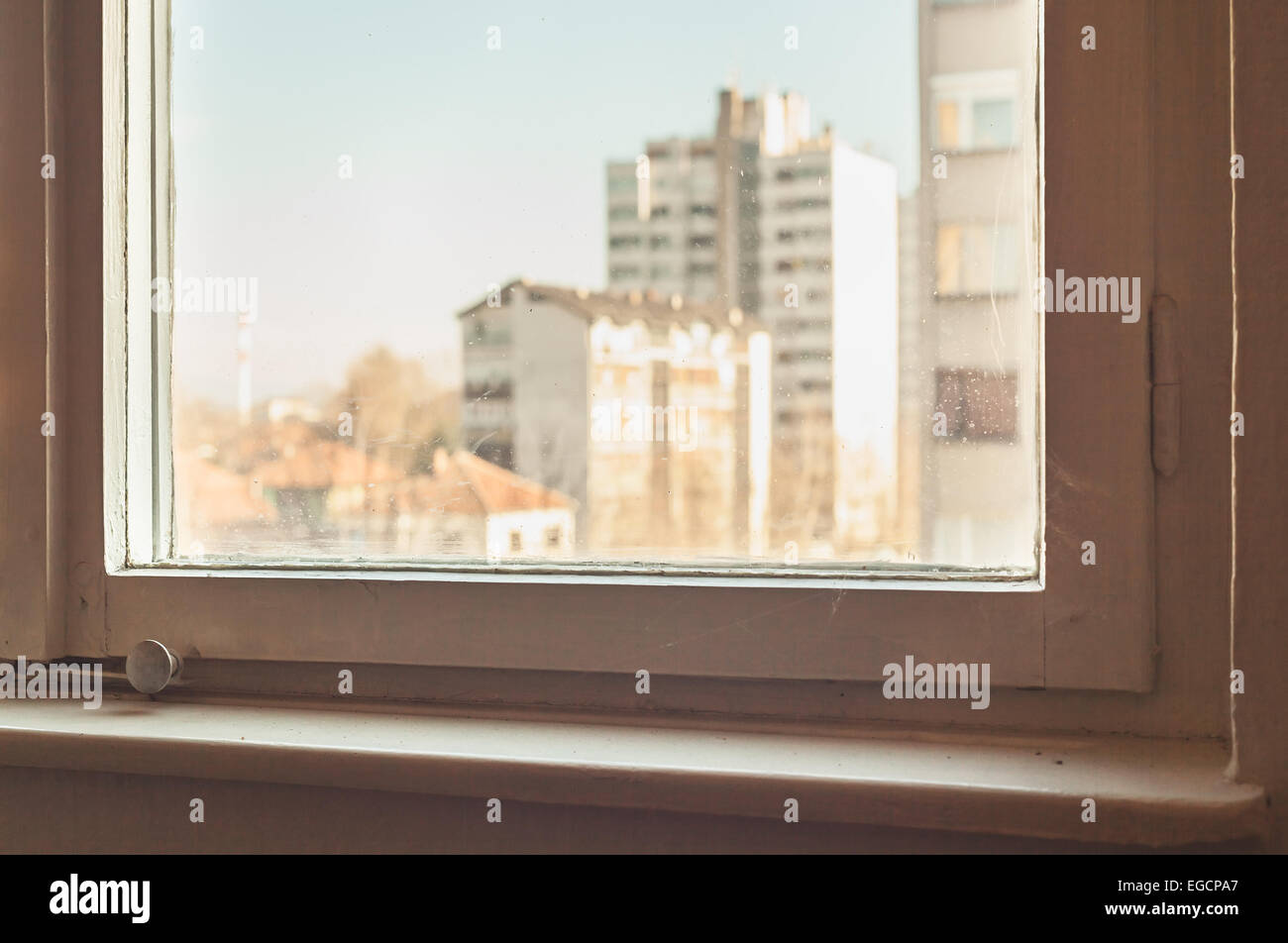 Details of an old wooden window and blurry buildings in far Stock Photo ...