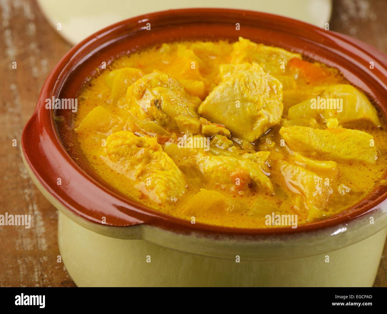 Curry in a bowl on wooden table. Selective focus Stock Photo - Alamy