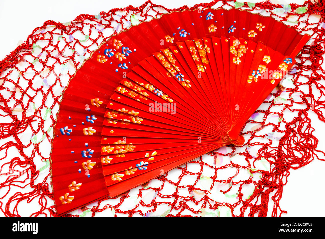 Red spanish fan on a white background Stock Photo - Alamy