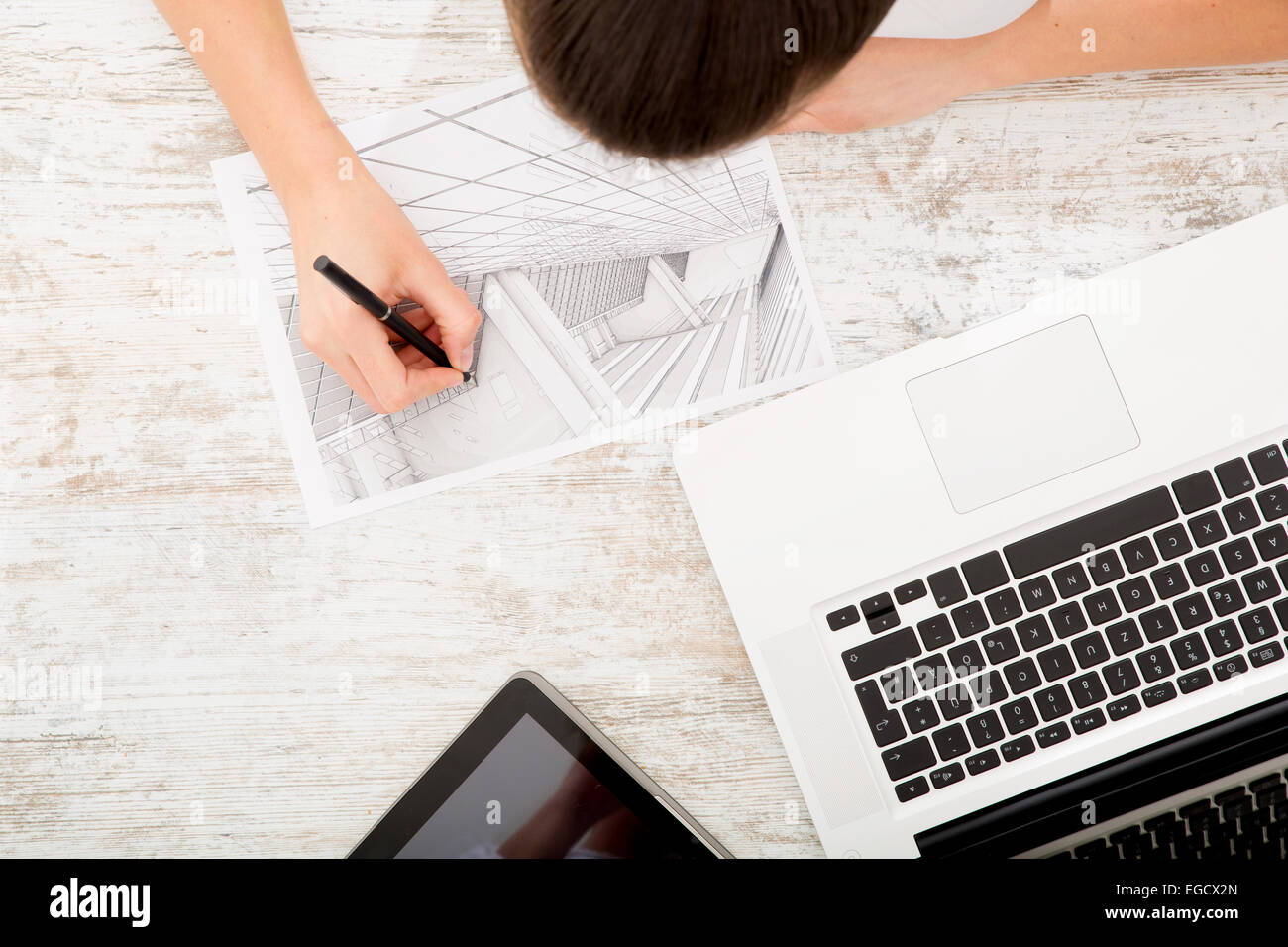 A young adult woman developing a architectural plan at home Stock Photo ...