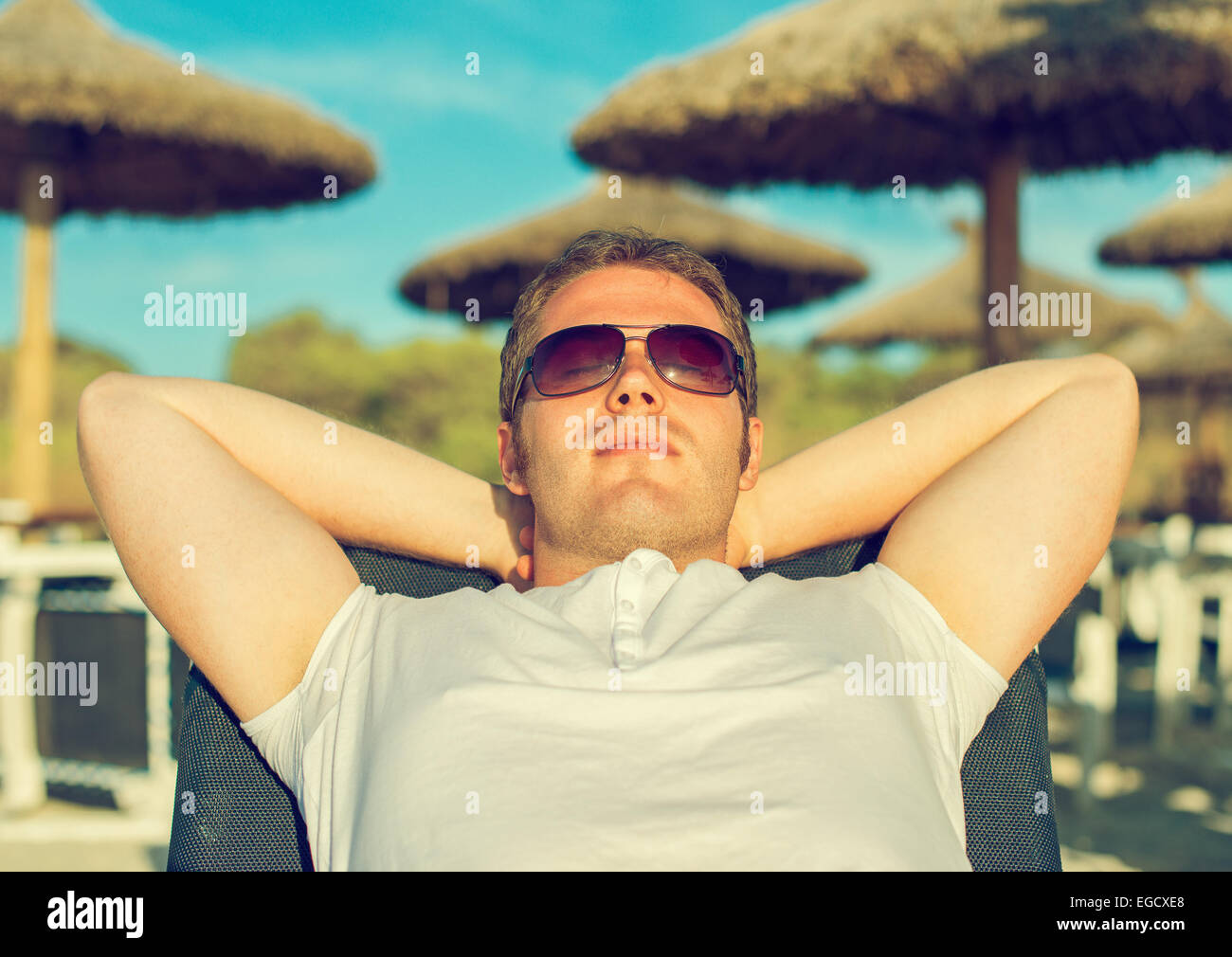 Man sleeping on beach hi-res stock photography and images - Alamy