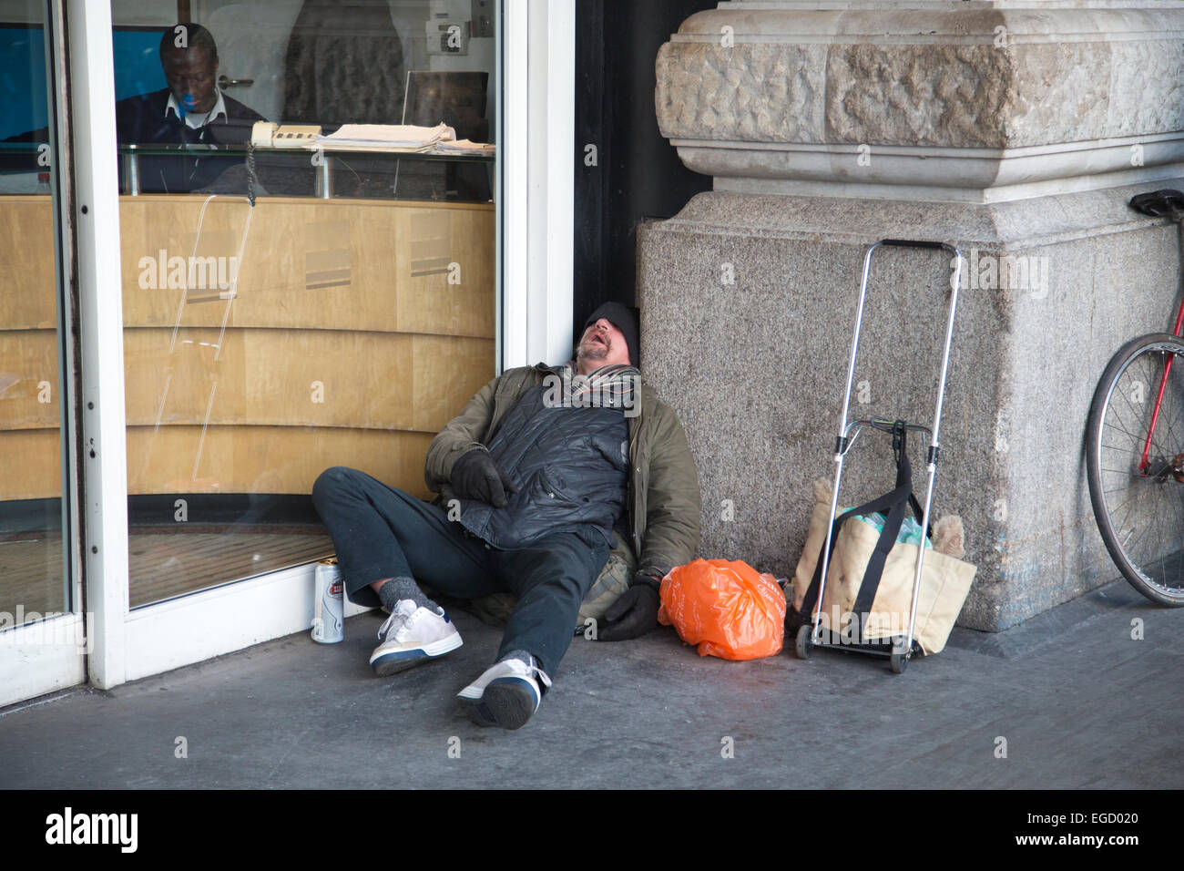 Homeless man sleeping rough outside Waterloo Station, London, England ...