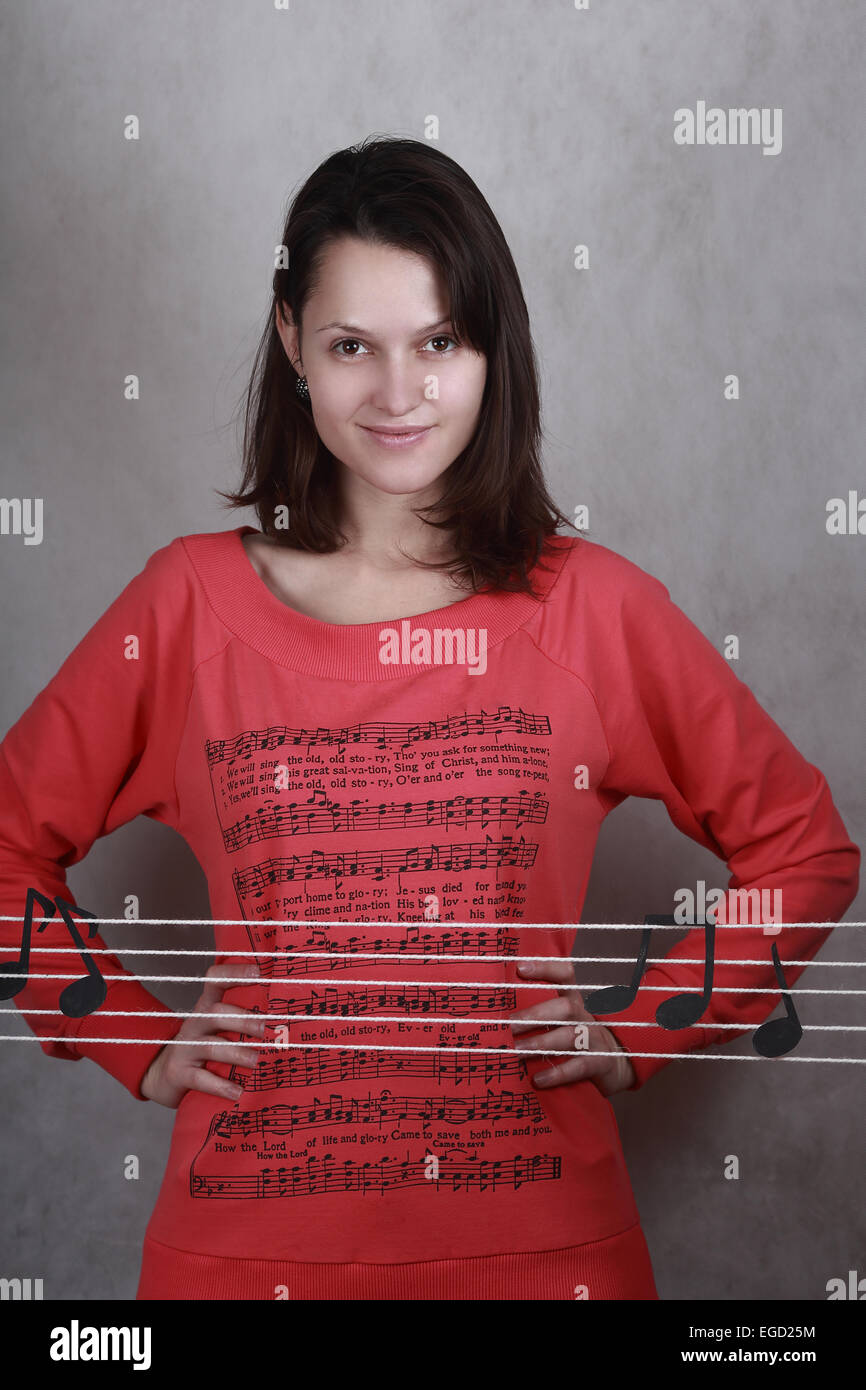 portrait of a smiling beautiful girl surrounded by notes Stock Photo ...