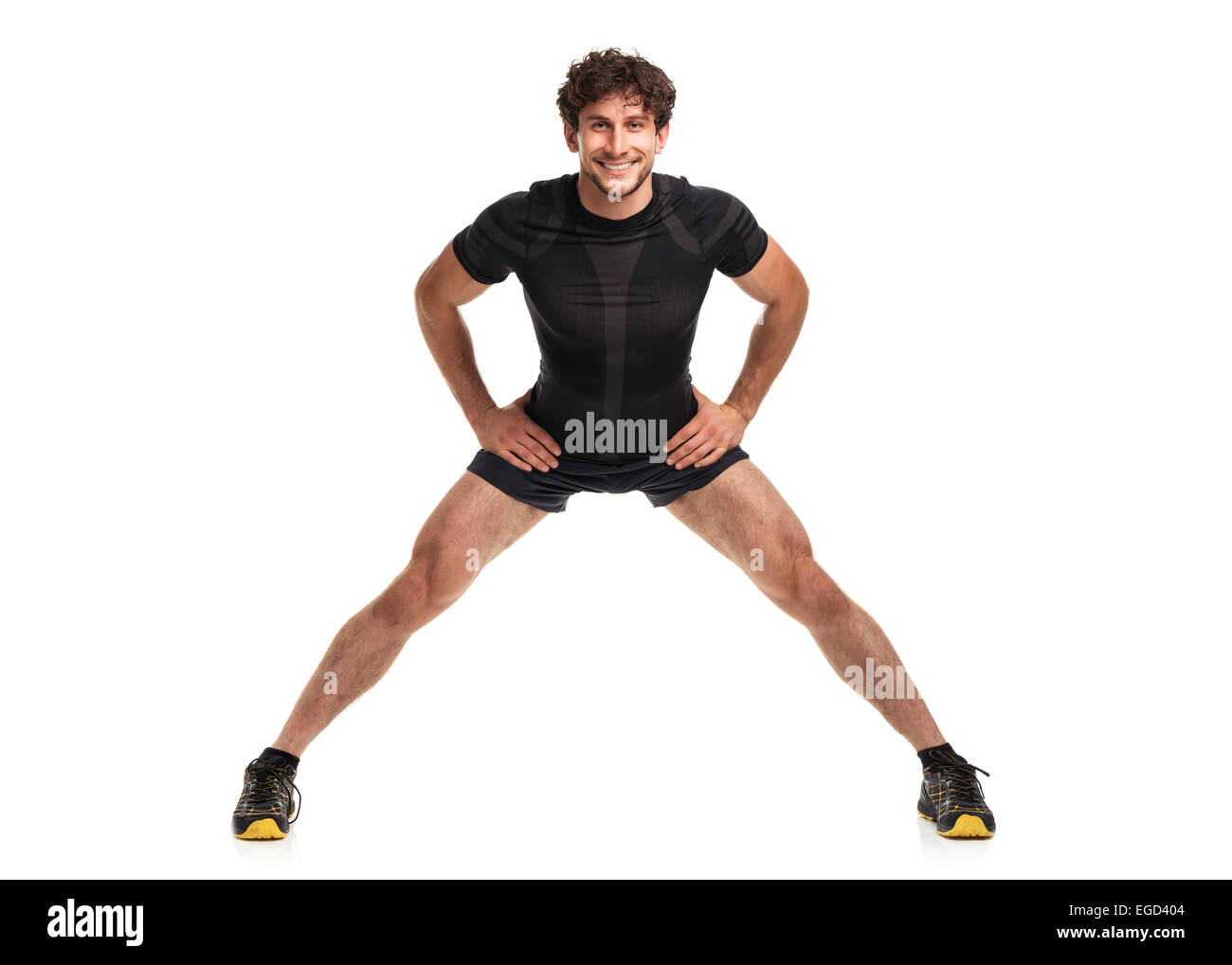 Athletic attractive man doing fitness exercise on the white background ...