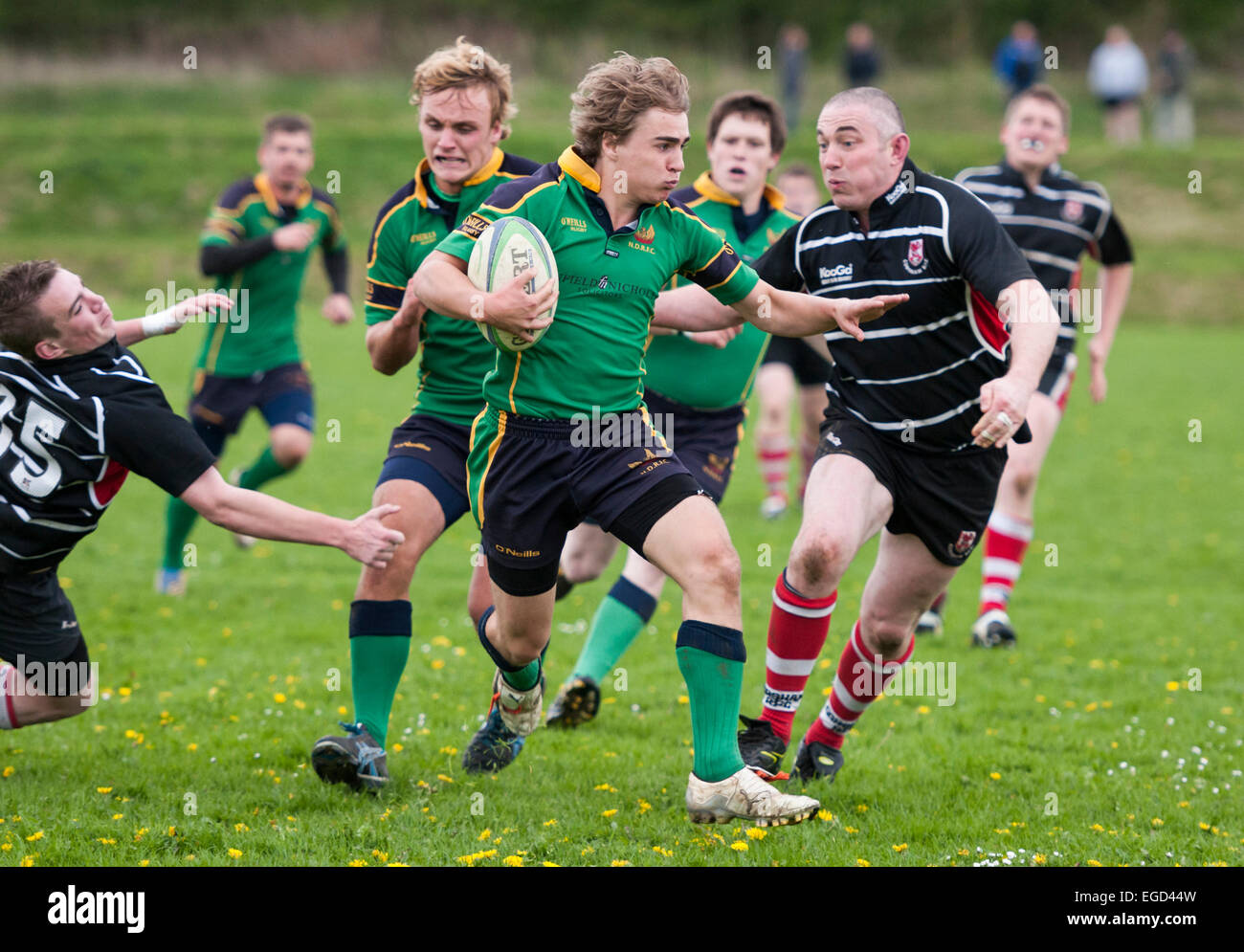 Rugby player in action running with the ball Stock Photo - Alamy