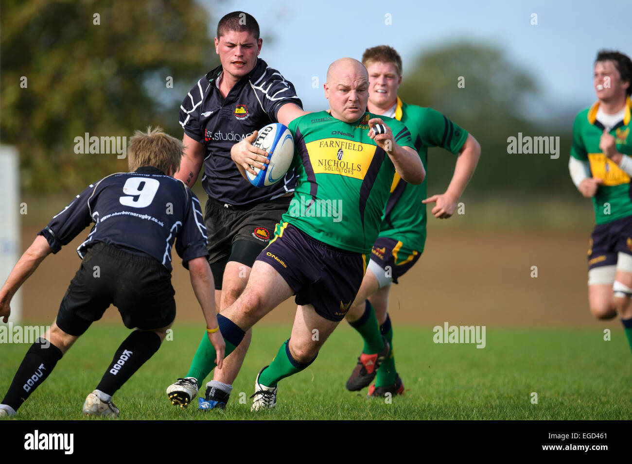 Rugby player in action running with the ball Stock Photo - Alamy