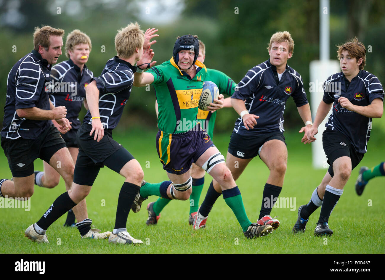 Rugby player in action running with the ball Stock Photo - Alamy