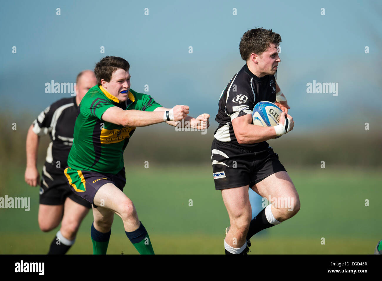 Rugby player in action running with the ball Stock Photo - Alamy