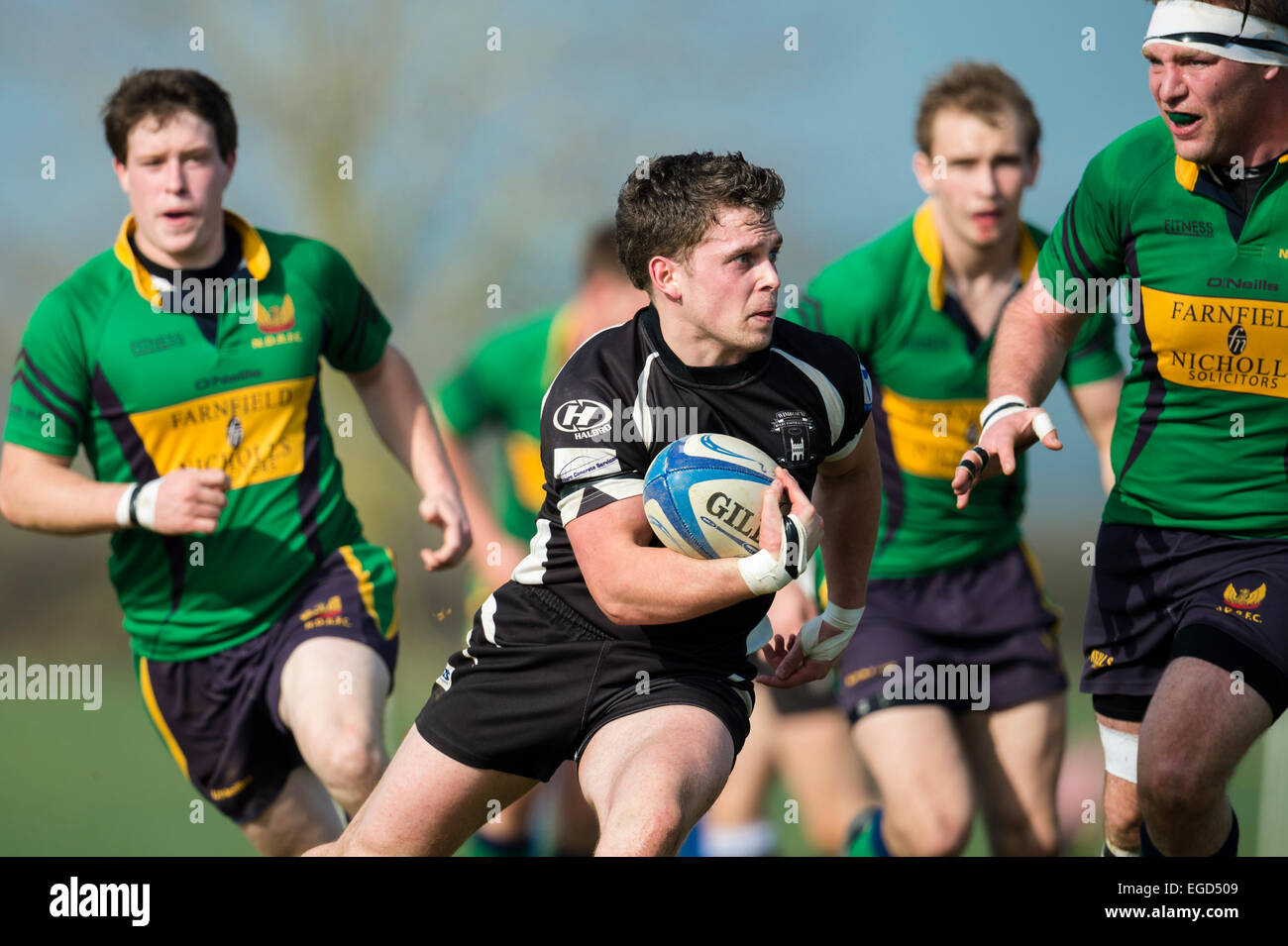 Rugby player in action running with the ball Stock Photo - Alamy