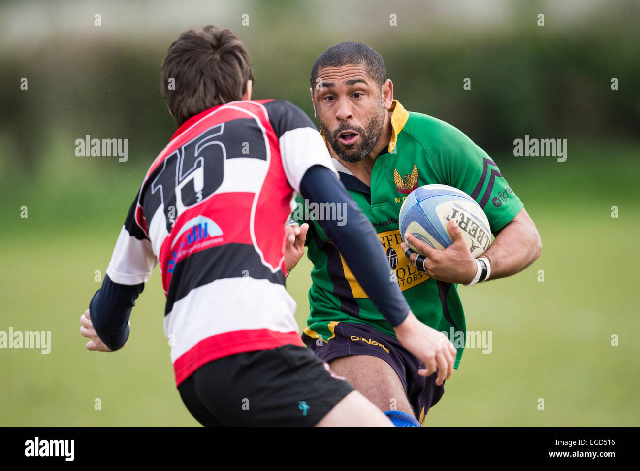 Rugby player in action running with the ball Stock Photo - Alamy