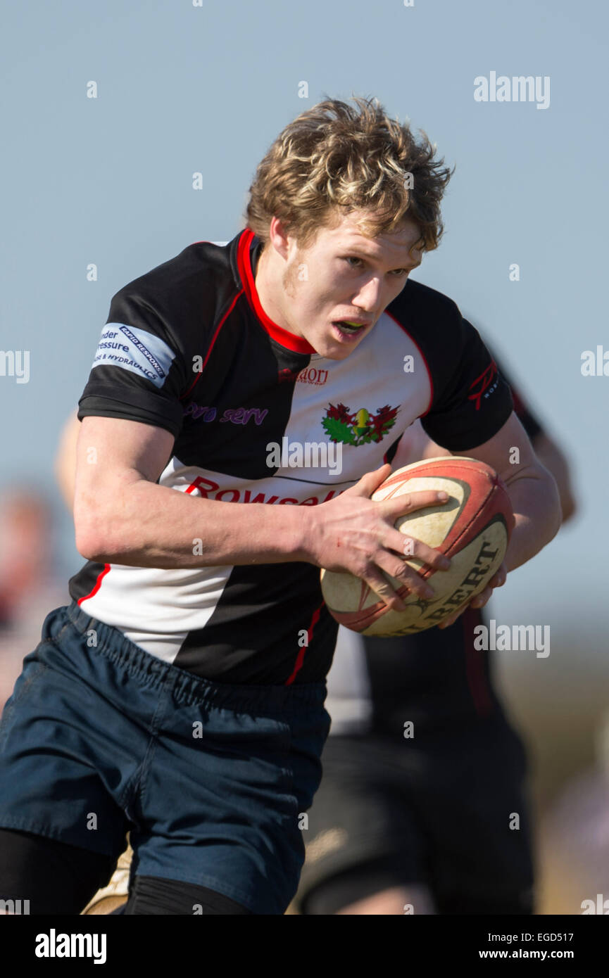 Rugby player in action running with the ball Stock Photo - Alamy