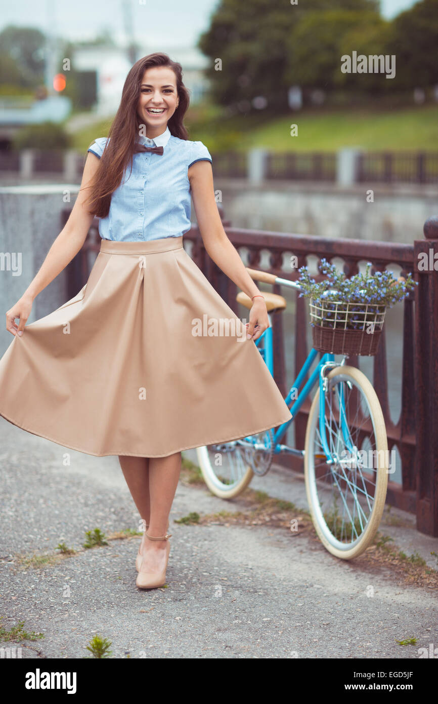 Young beautiful, elegantly dressed woman with bicycle. Beauty, fashion ...