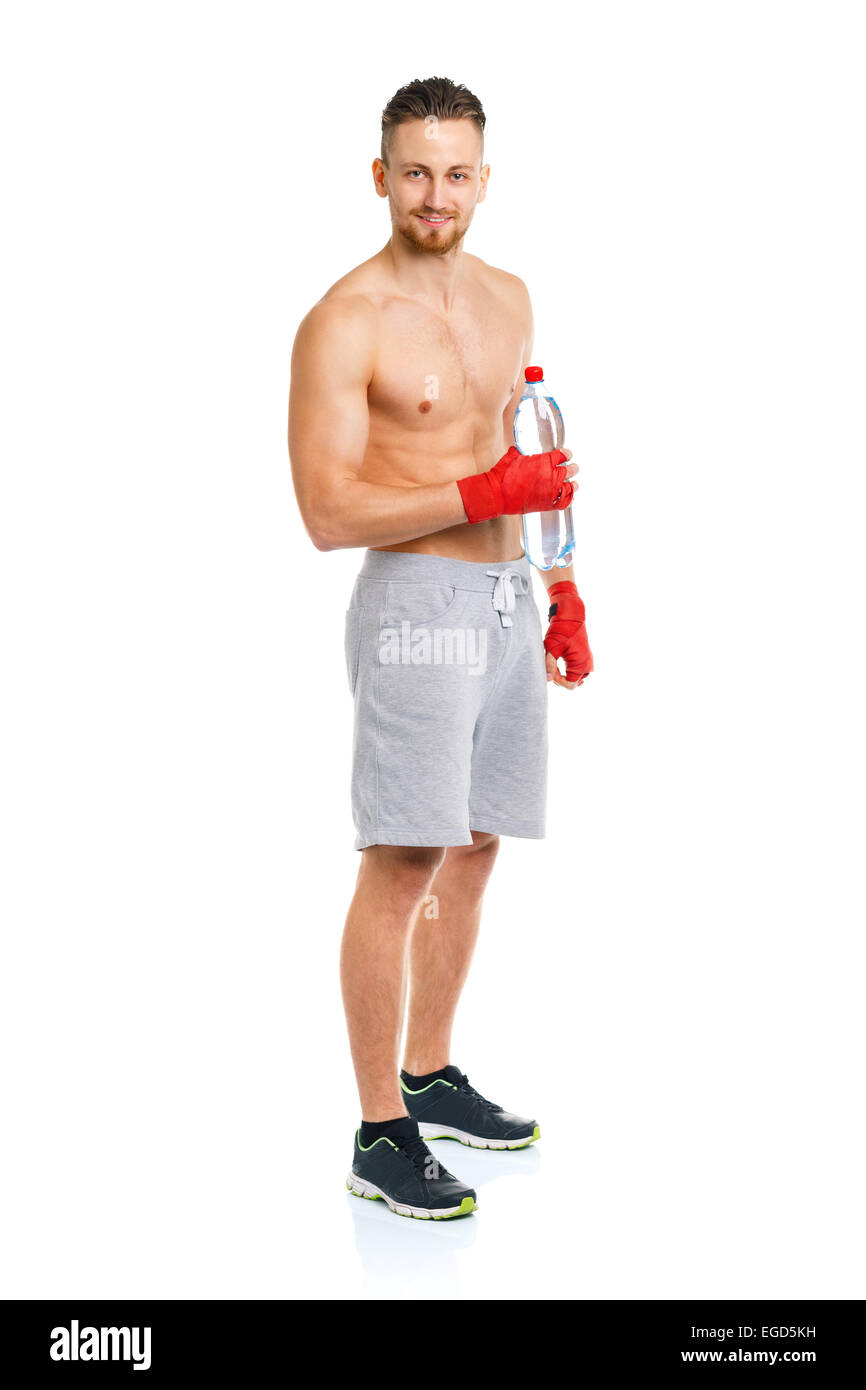 Sport attractive man wearing boxing bandages with bottle of water on ...