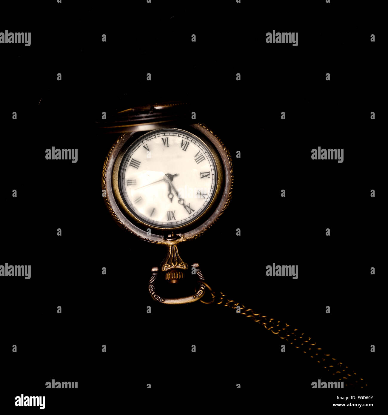 Vintage pocket watch over black background Stock Photo - Alamy