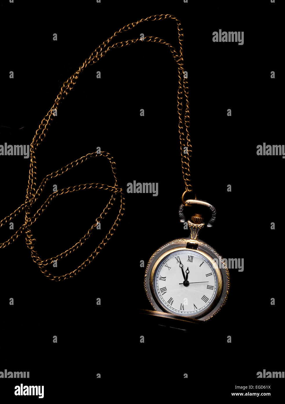 Chained vintage watch over black background Stock Photo - Alamy