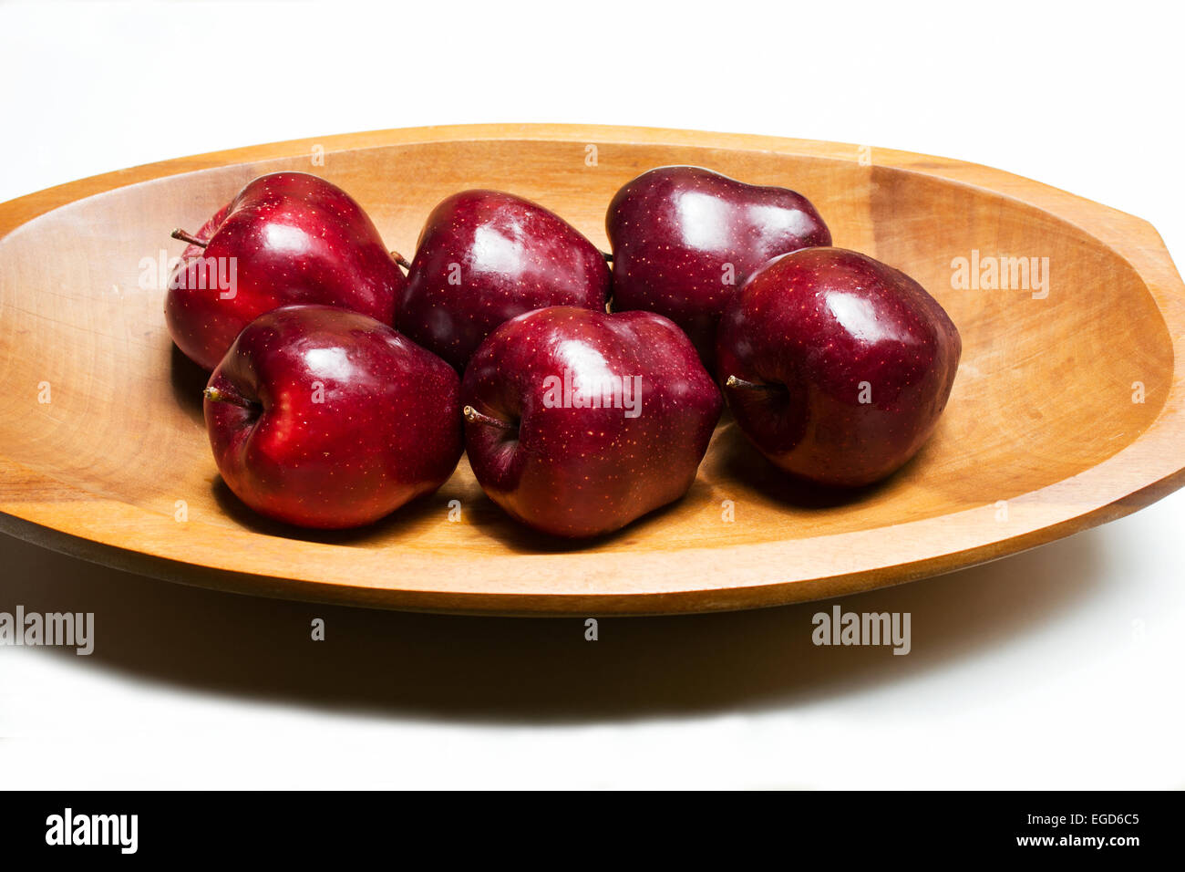 six red apples on white background on a wooden platter Stock Photo - Alamy