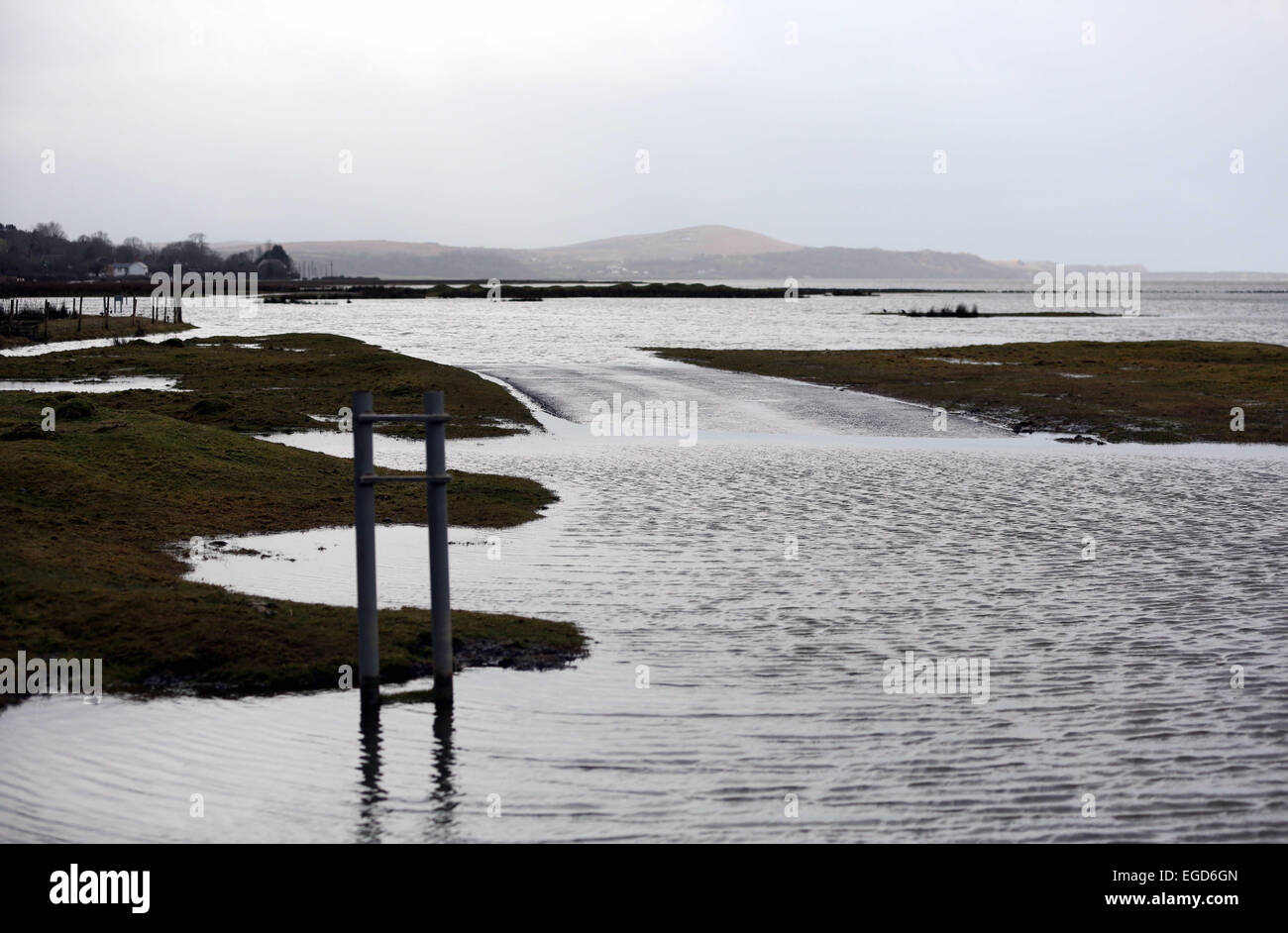 Crofty, UK. Monday 23 February 2015 Pictured: The flooded road during ...