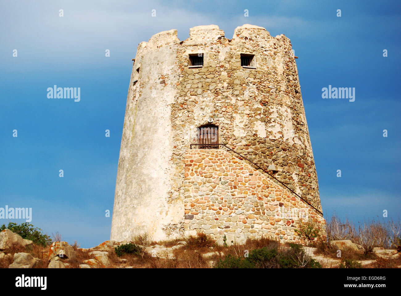 Spanish ancient tower in the coast with vivid blue sky back for tourism ...