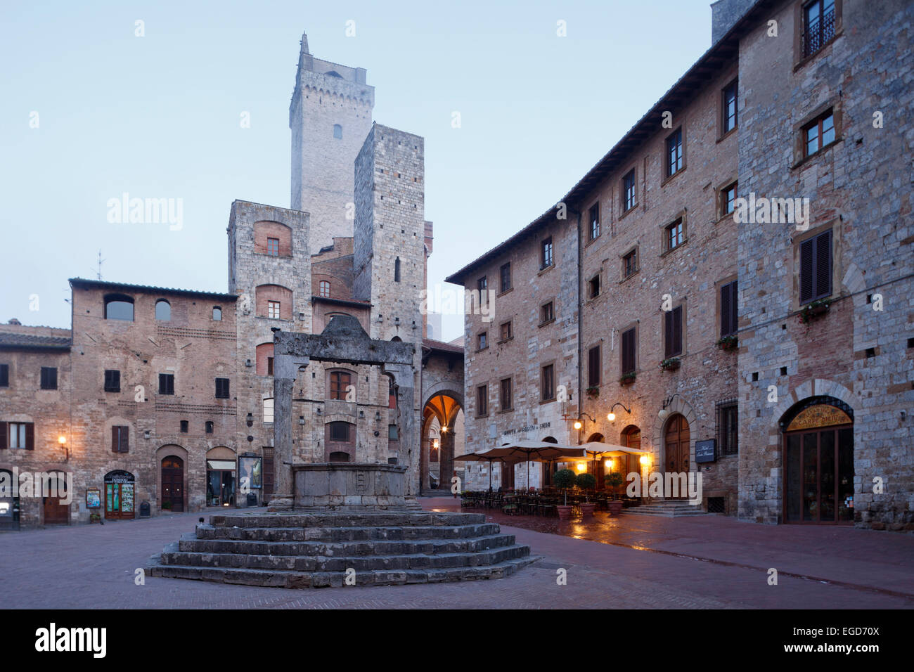 Towers and fountain on Piazza della Cisterna square, San Gimignano ...
