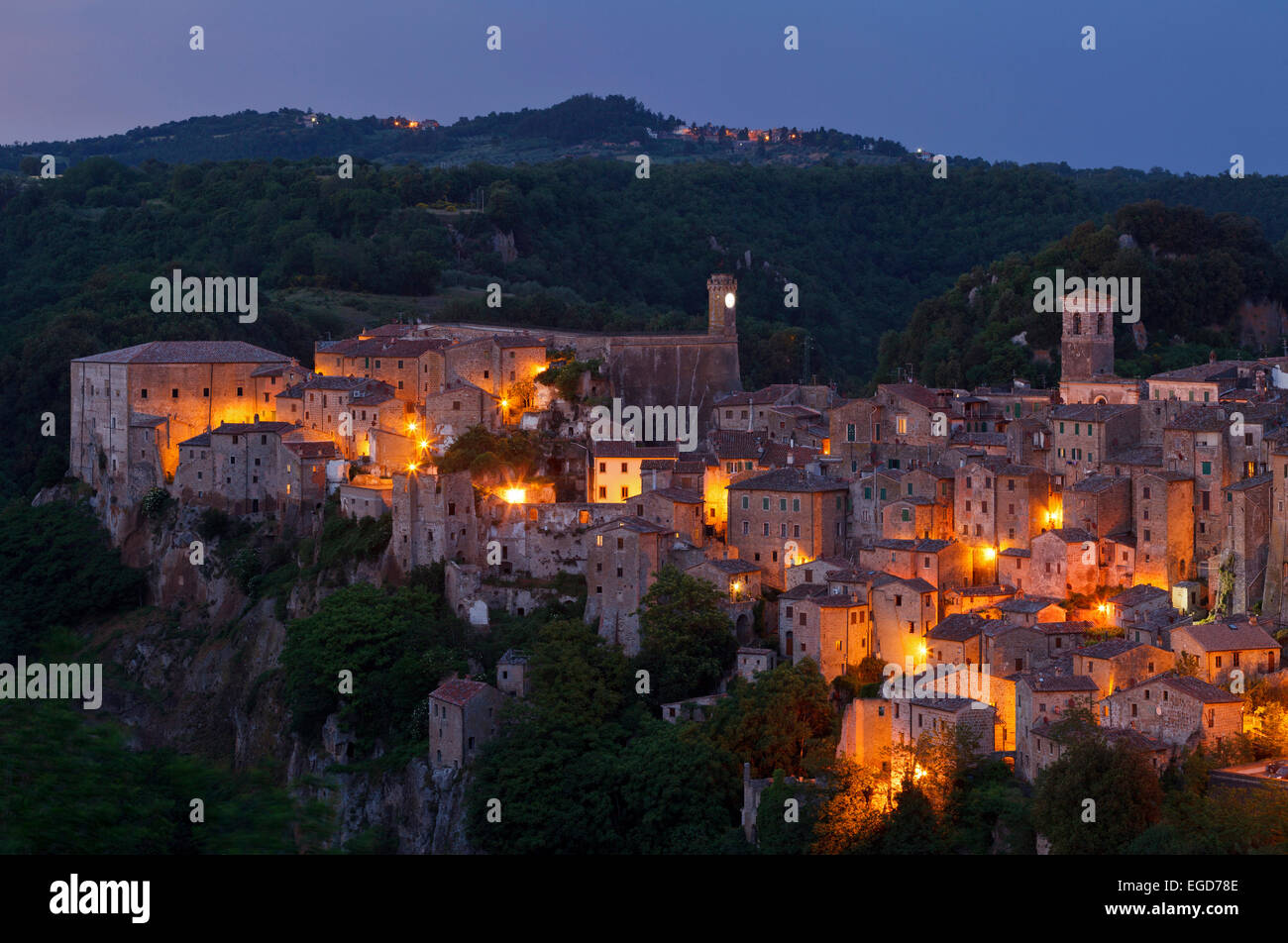 Sorano, an ancient medieval hill town in the evening light, province of ...