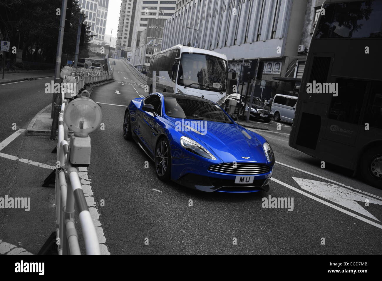 Blue car in Hong Kong traffic Stock Photo - Alamy