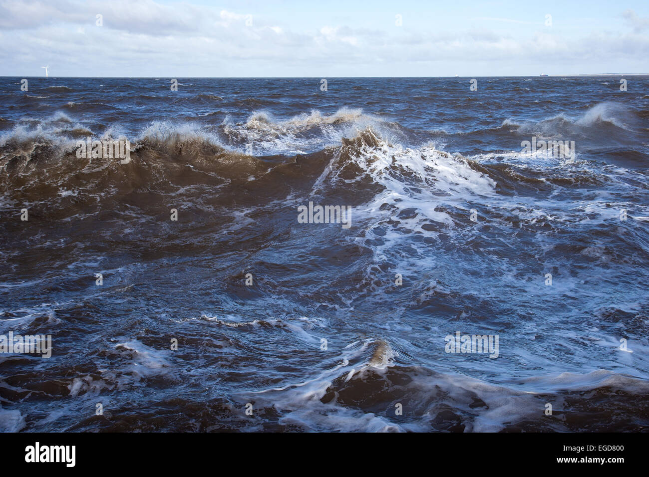 Large towering waves in a storm tossed sea Stock Photo - Alamy