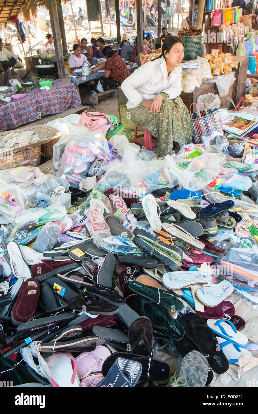 Locals at 5 Day Market, a rotating system,on banks of Inle Lake. Here ...