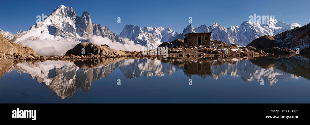 Panorama of the Savoy Alps with reflection in the mountain lake Lac ...